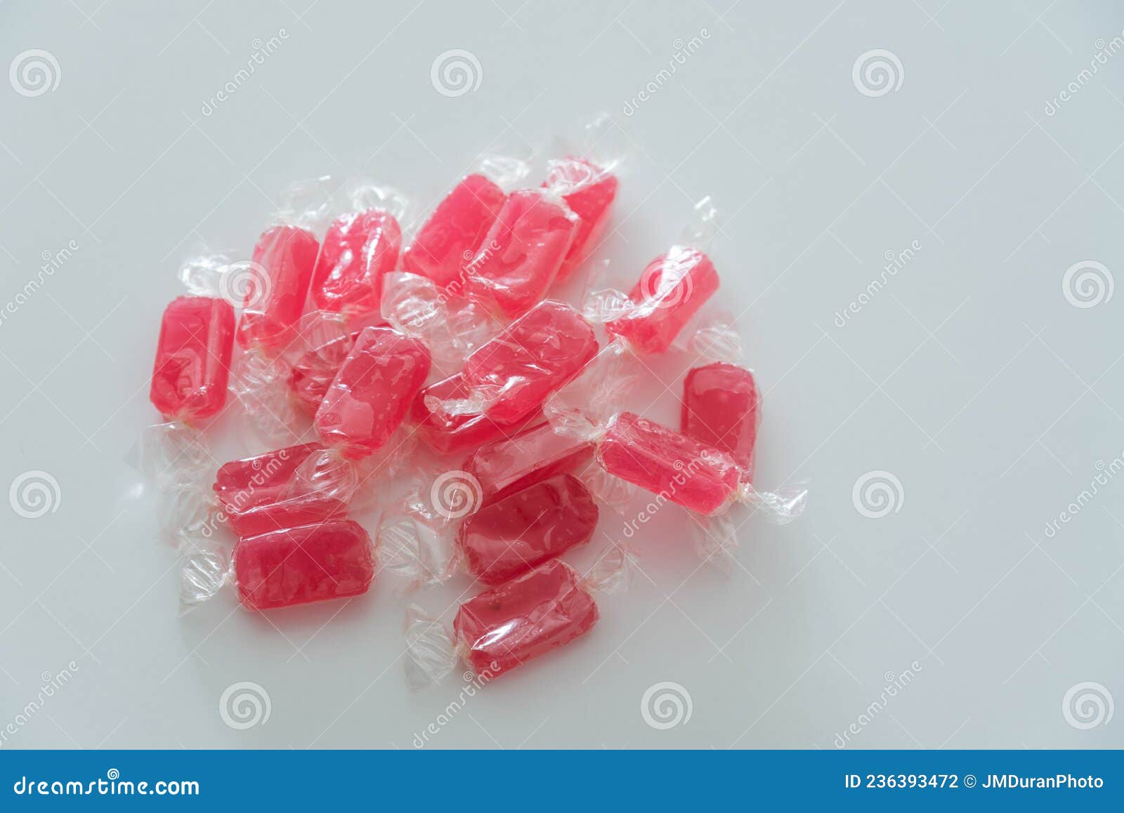 Red Candies in Transparent Wrapper on White Background Close Up Top ...