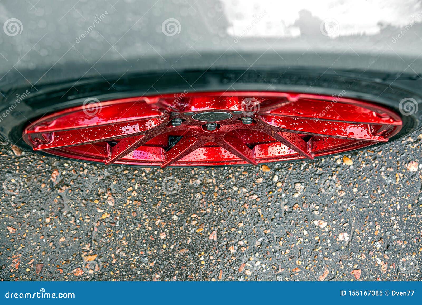 Red Candy Colored Light Alloy Wheels on Asphalt Background. in ...