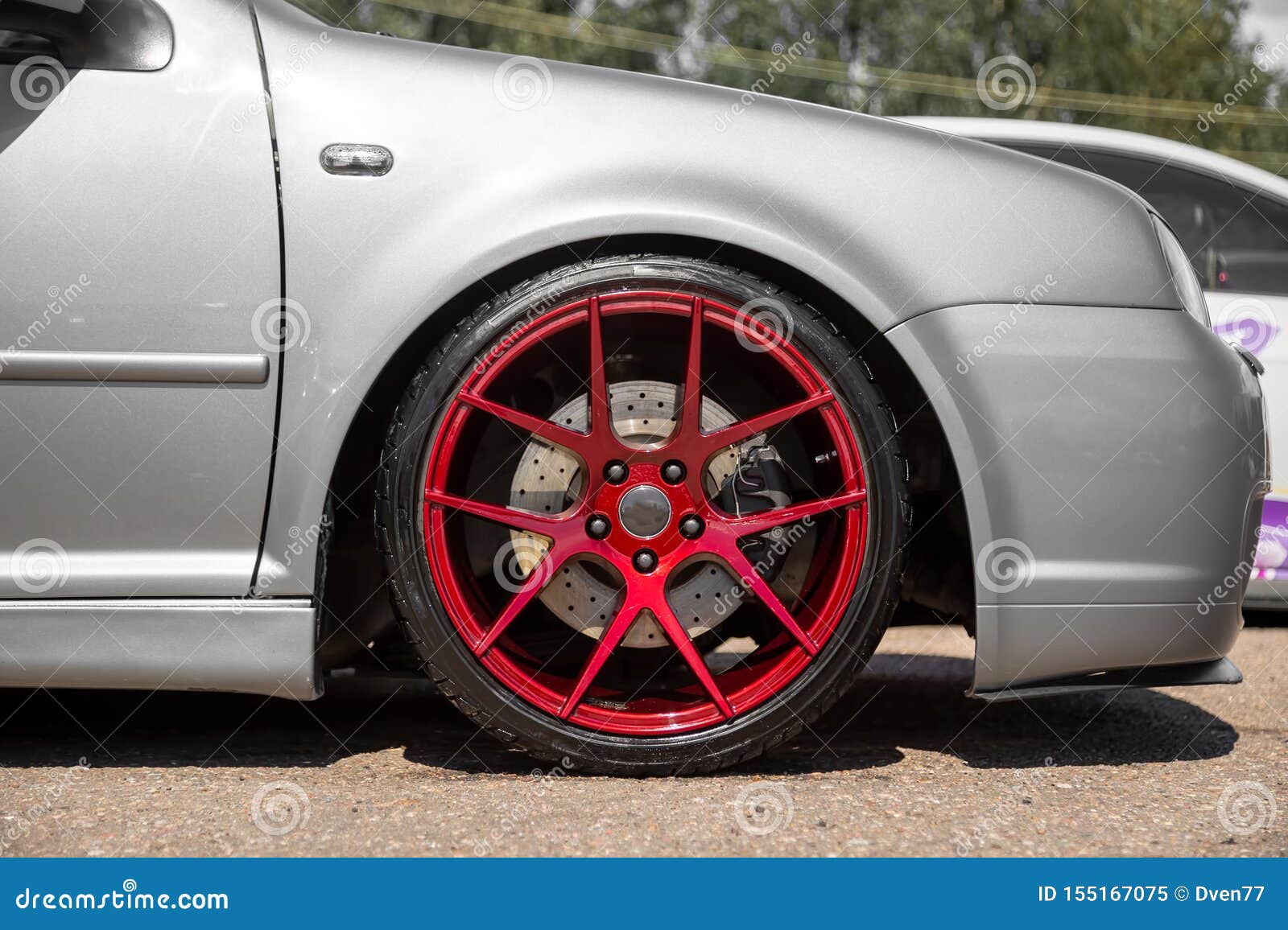 Red Candy Colored Light Alloy Wheels on Silver Hatchback Stock Image ...
