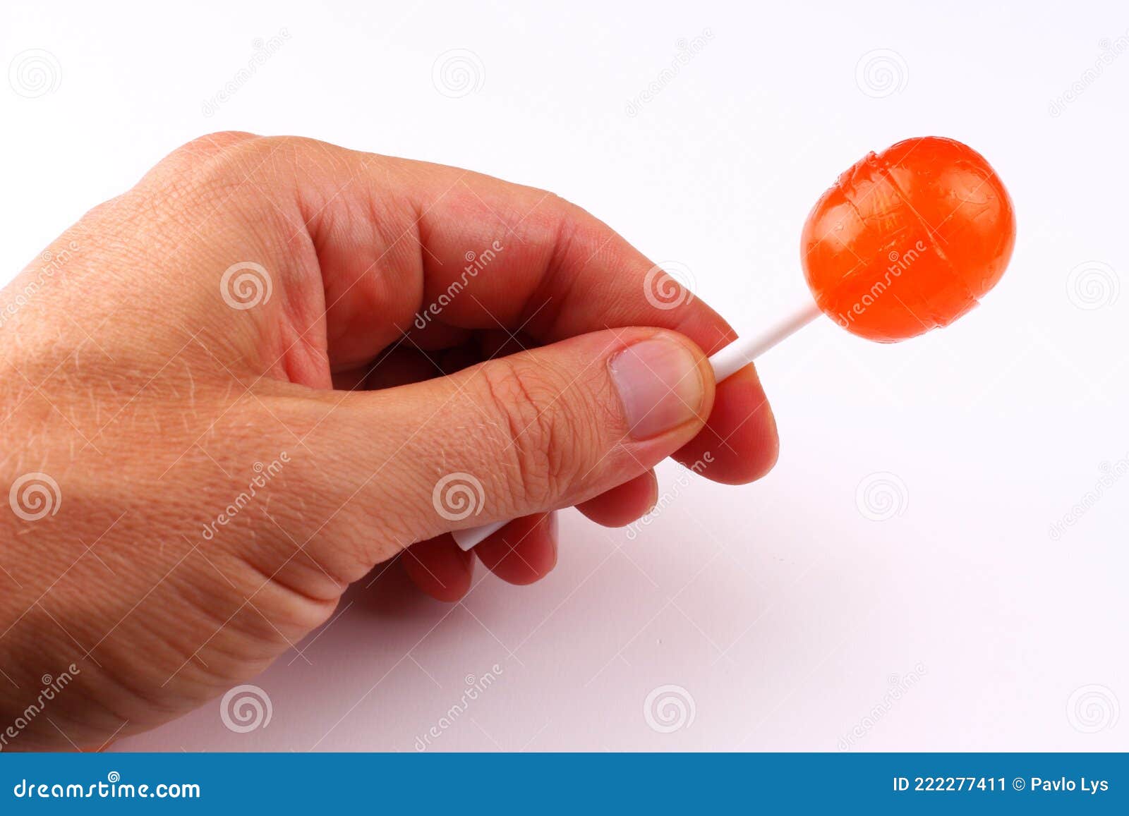 Red Candy in Hand on a Stick on a White Background Stock Image - Image ...