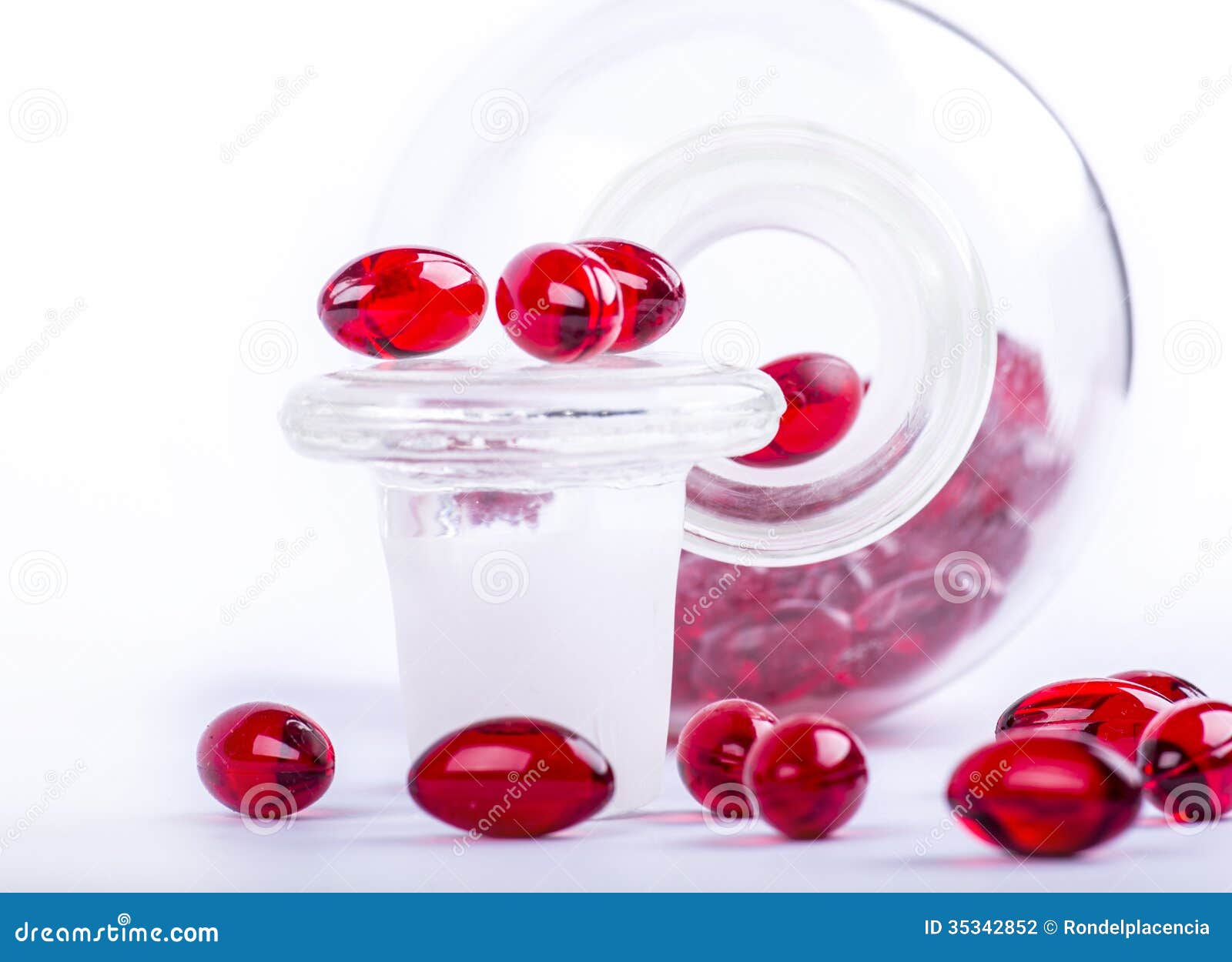 Red capsules on bottle stock photo. Image of alternative - 35342852