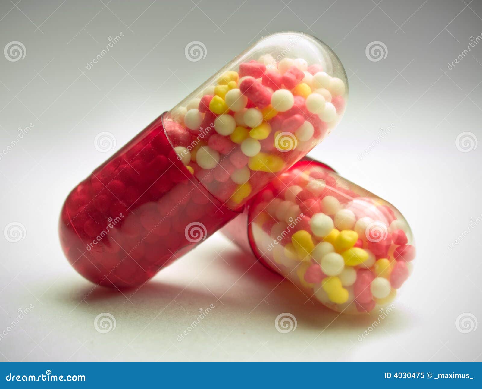 Red capsules over gray stock image. Image of capsule, backgrounds - 4030475