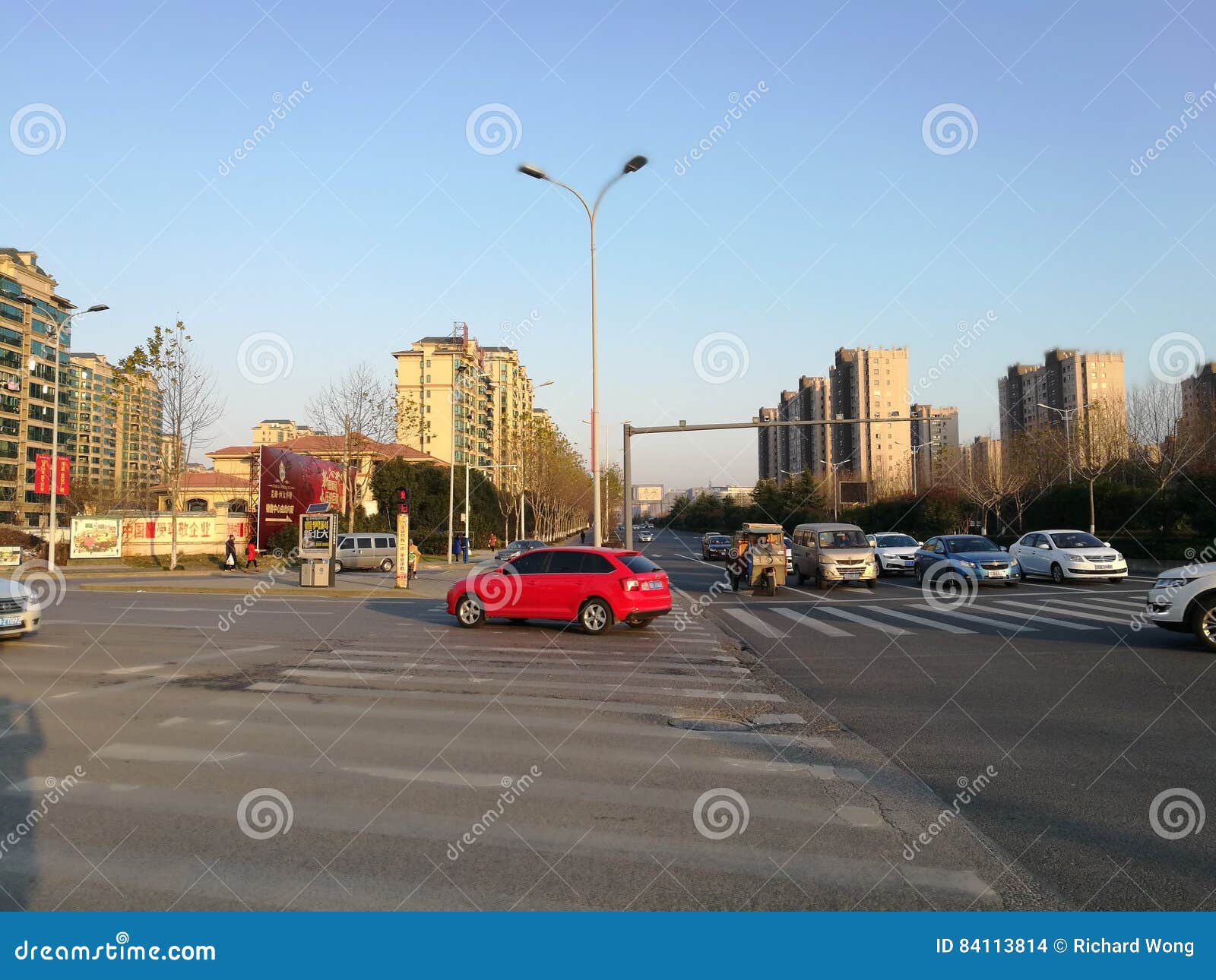 A Red Car Crossing the Street in the Cross Editorial Stock Image ...