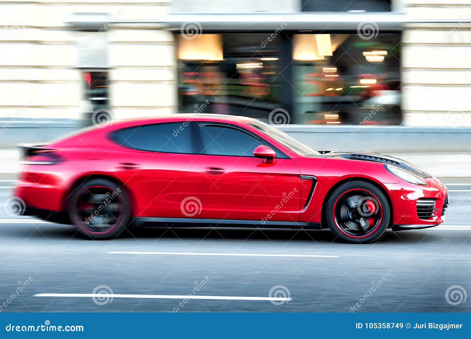 Red car goes on city stock image. Image of move, speed - 105358749