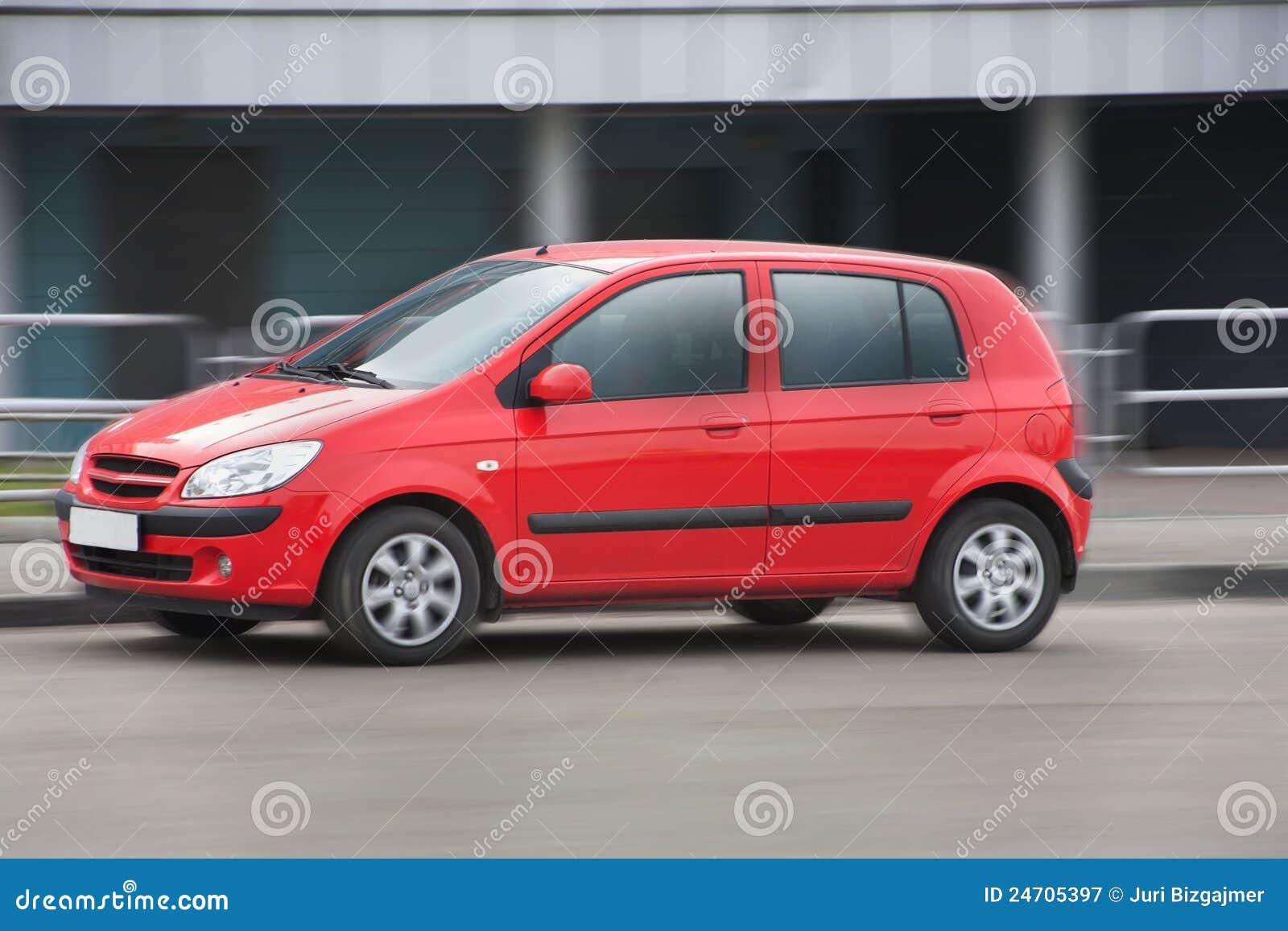 Red Car Goes on City Street Stock Image - Image of street, side: 24705397