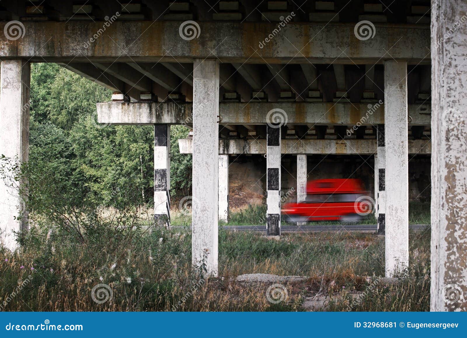 Red Car Goes Fast Under Old Bridge Stock Image - Image of automobile ...