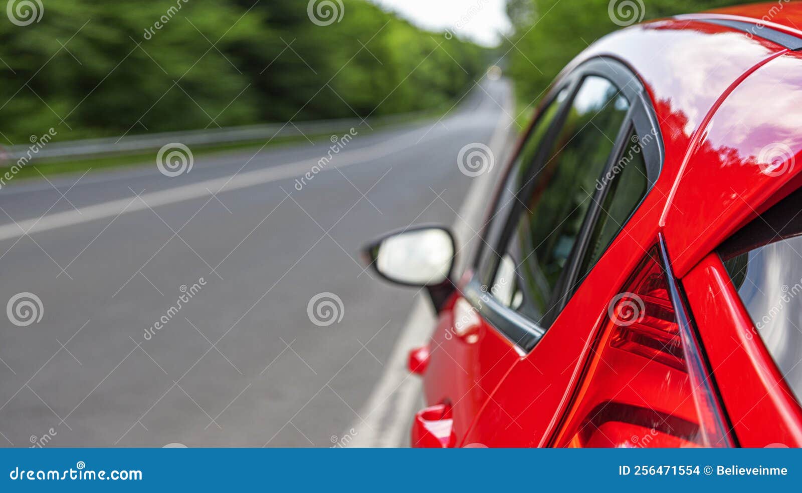 Red car on the road. stock photo. Image of asphalt, shiny - 256471554