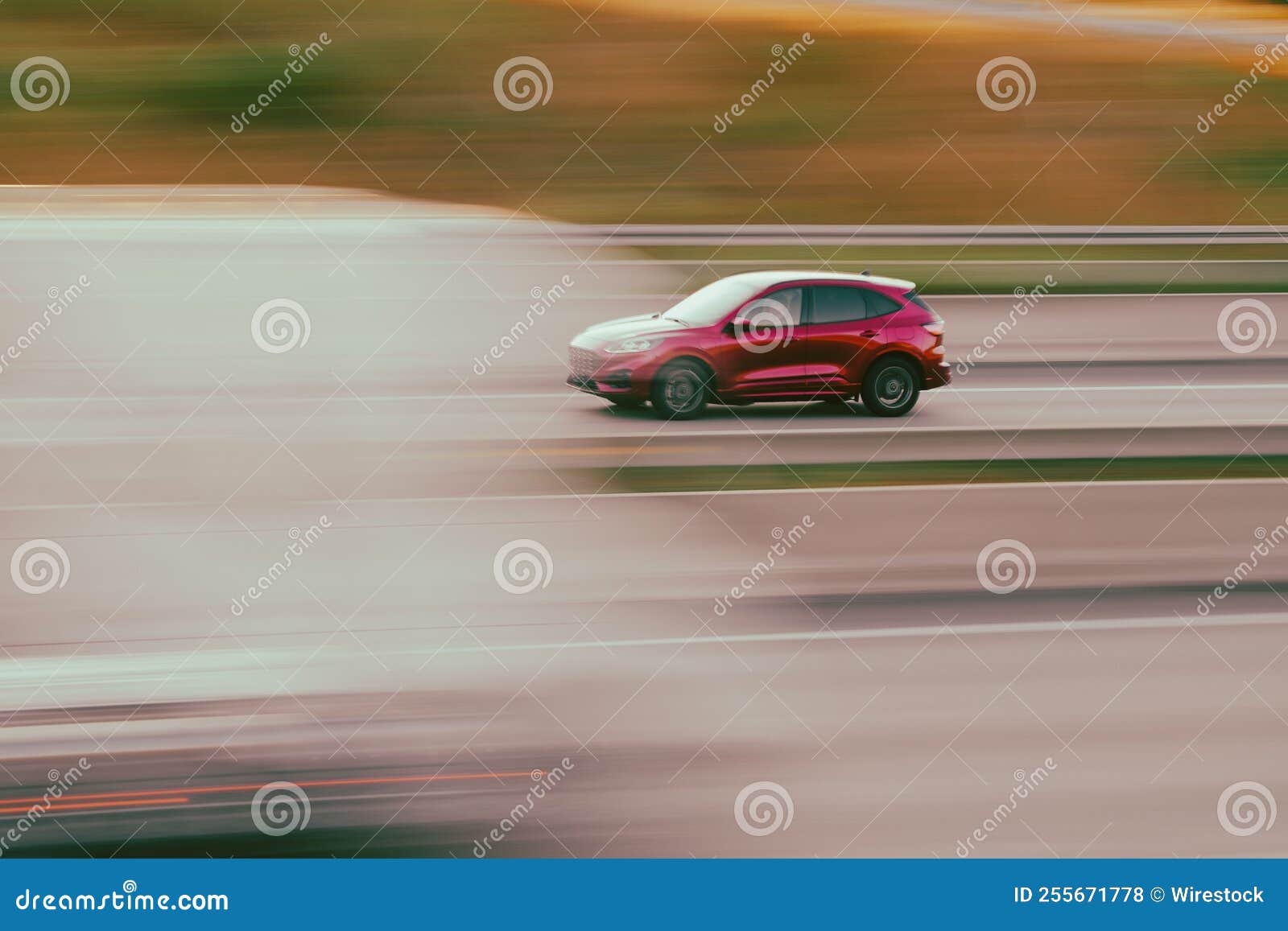 Red Car Speeding in Motion on a Highway on a Sunny Day Stock Photo ...