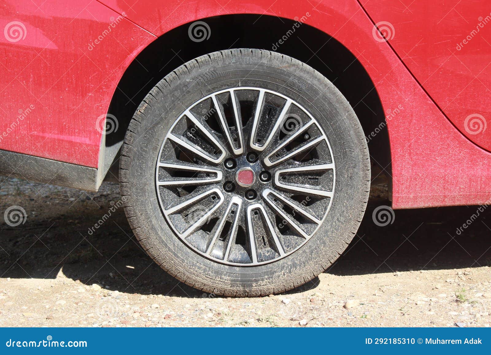 Red car wheels on ground stock photo. Image of ground - 292185310