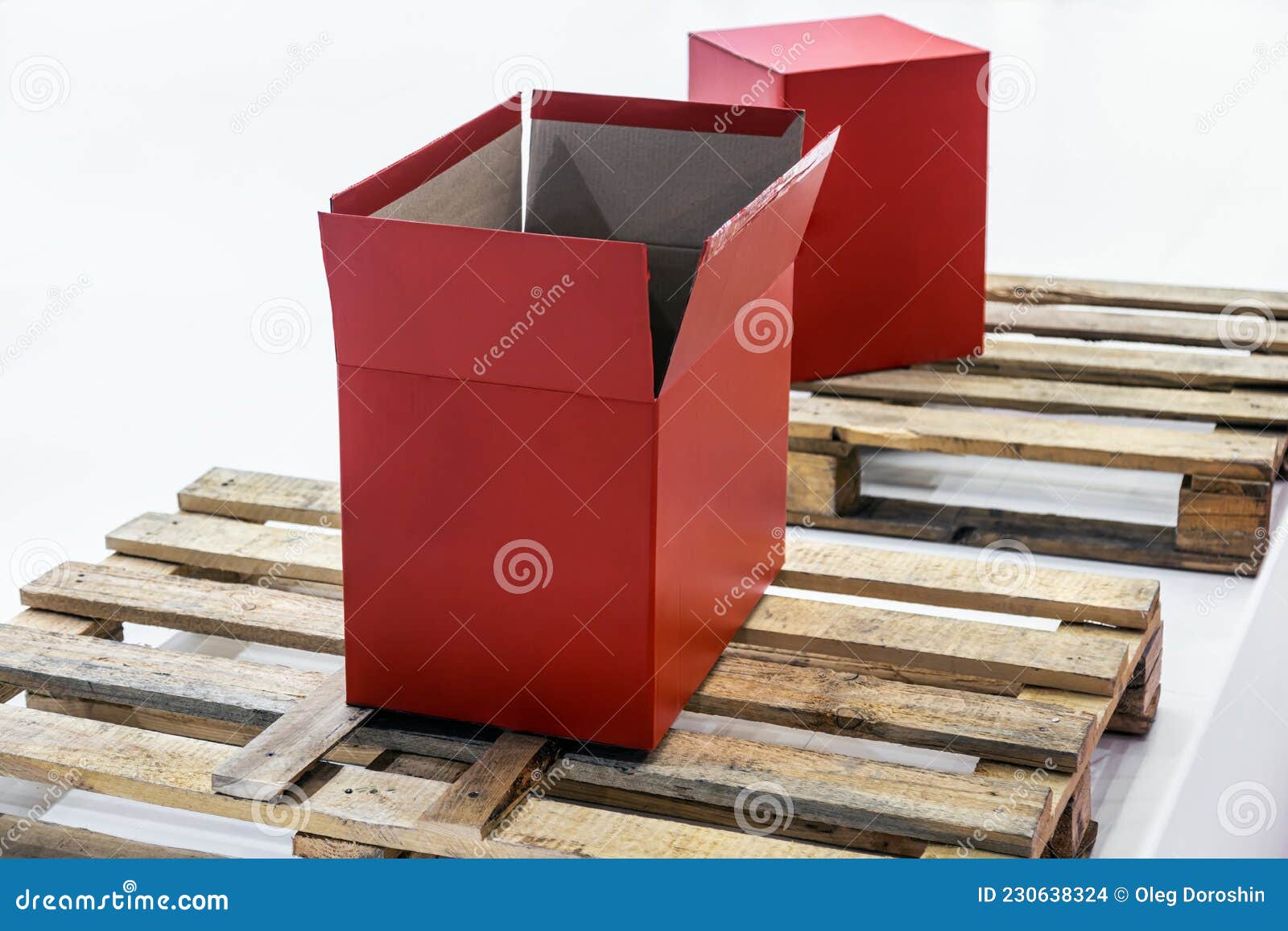 Red Cardboard Boxes, Empty on a Wooden Pallet Stock Photo - Image of ...
