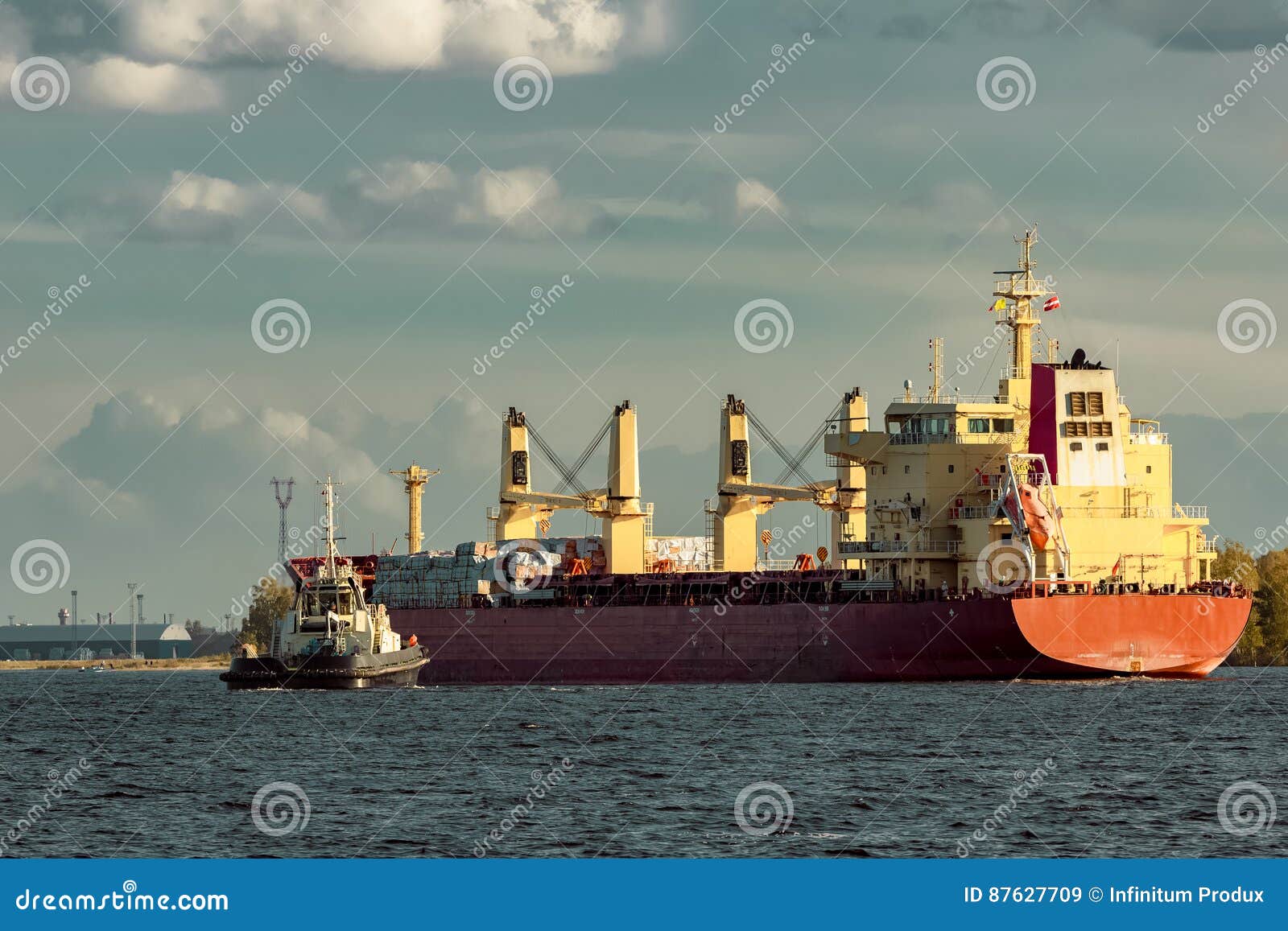 Red Cargo Ship and the Tug Ship Stock Image - Image of moving, river ...