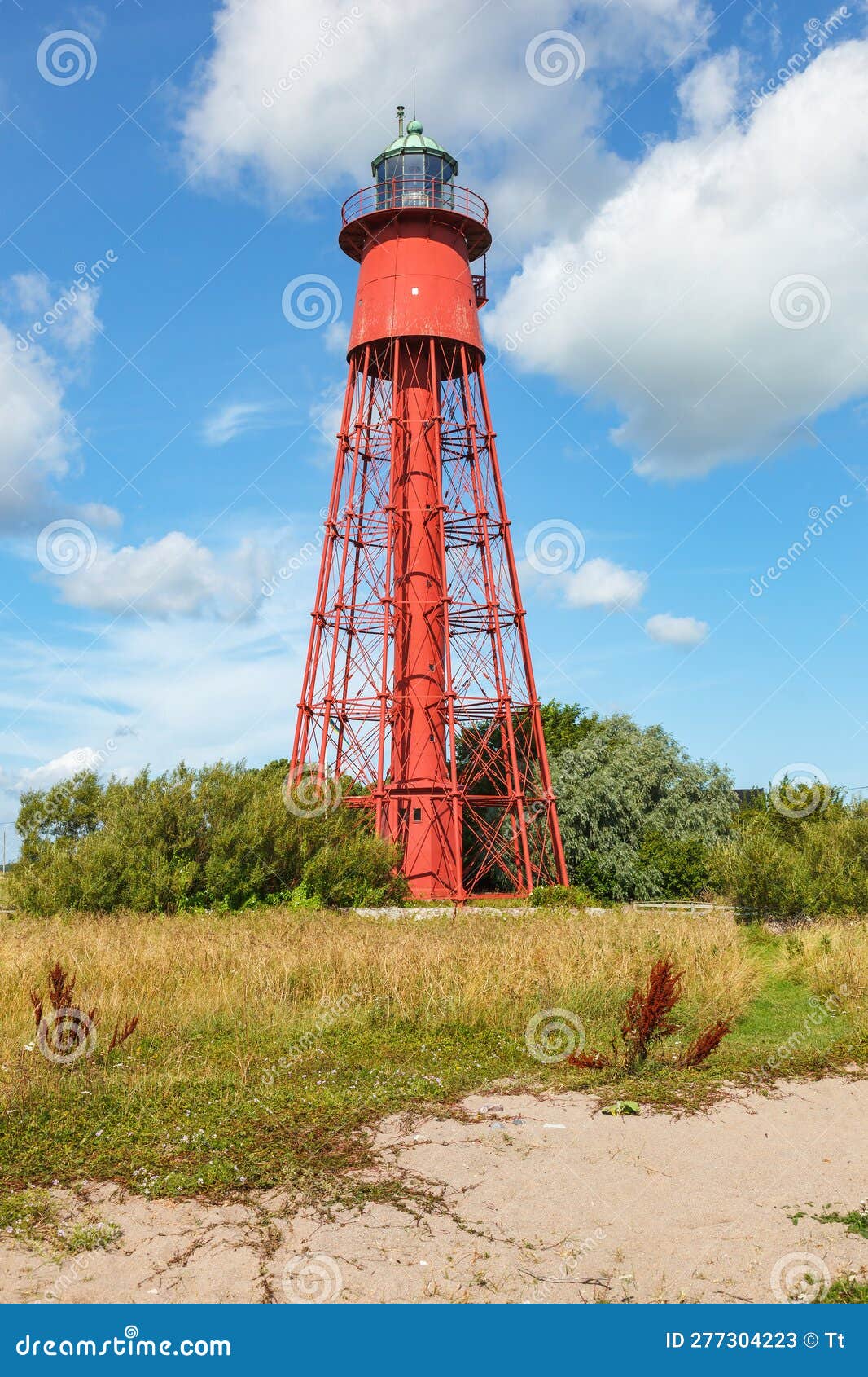 Red Cast Iron Lighthouse on the Beach Editorial Stock Photo - Image of ...