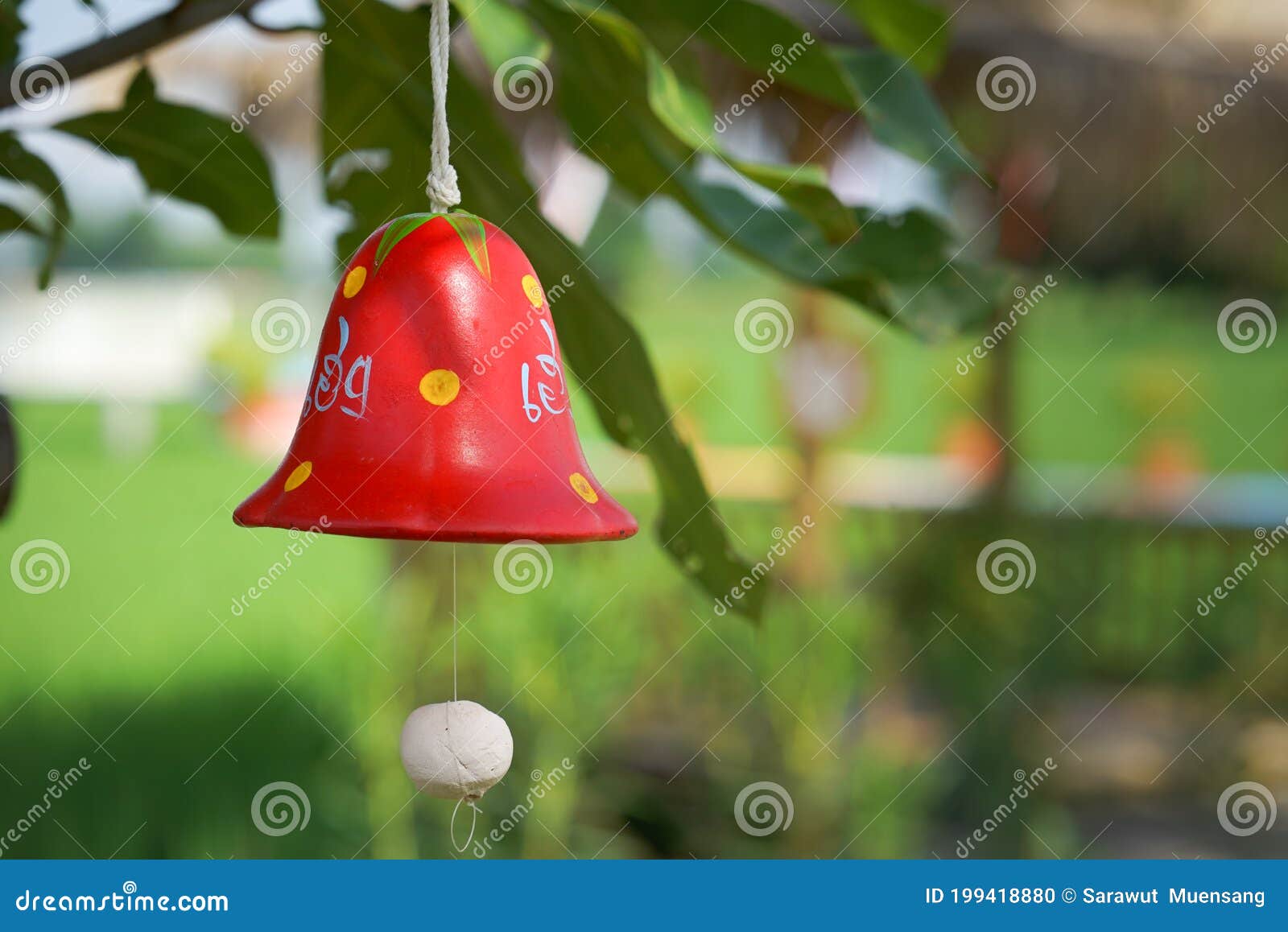 Red ceramic bells hanging stock photo. Image of flowers - 199418880