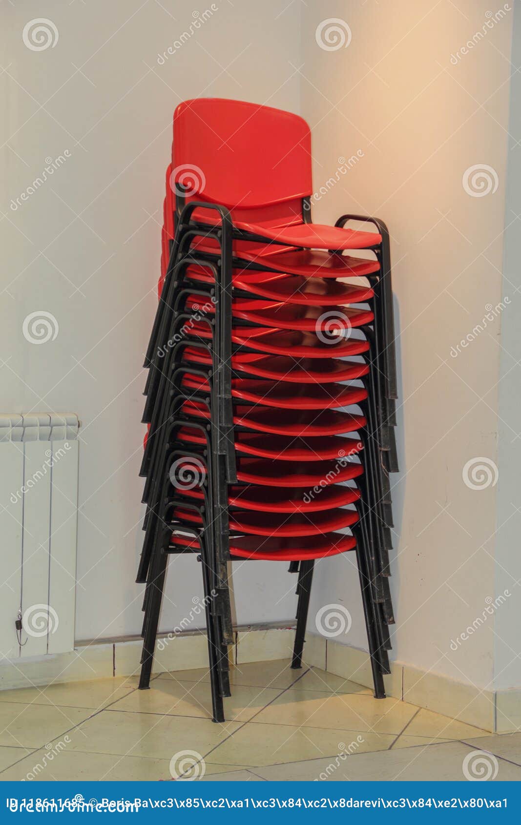 Red Chairs with Black Legs in a Stack. Stock Image - Image of ...