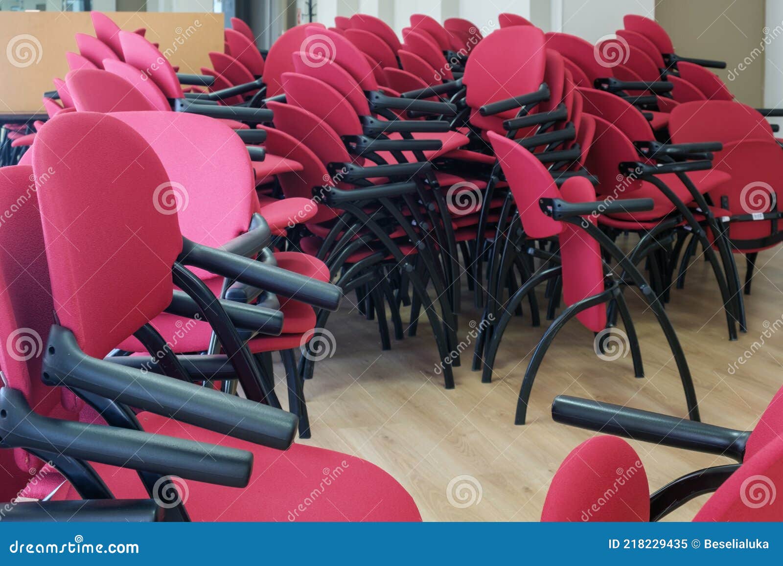 Red chairs stacked stock image. Image of tight, light - 218229435