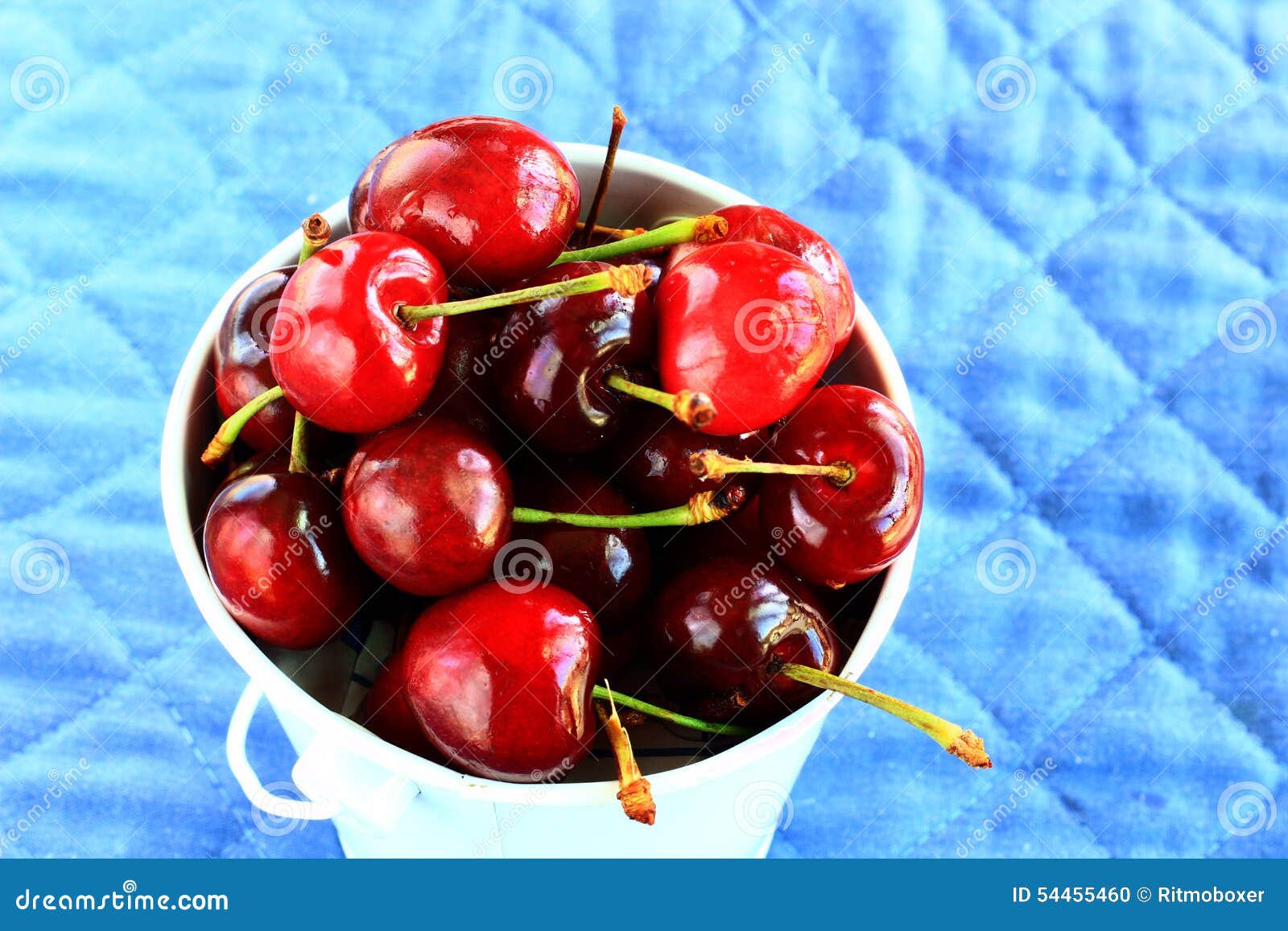 Red cherries in a bucket stock photo. Image of dessert - 54455460