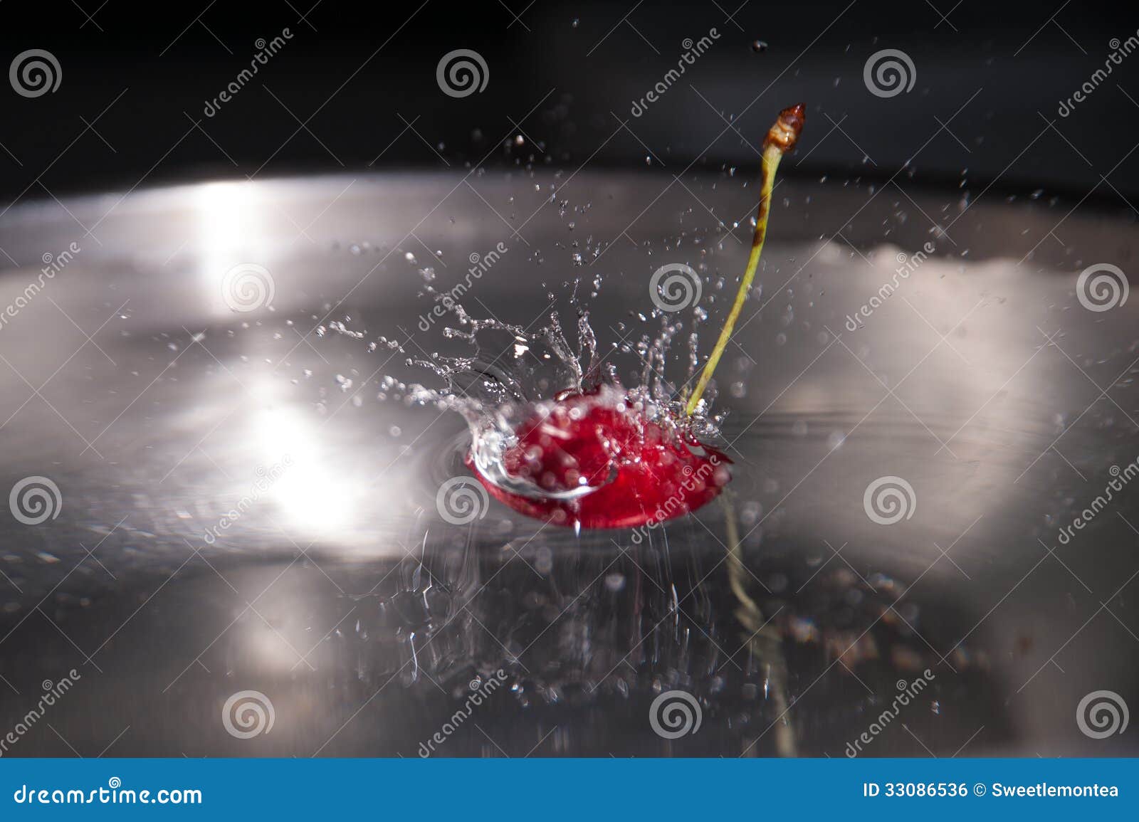 Red Cherry drop into water stock photo. Image of color - 33086536