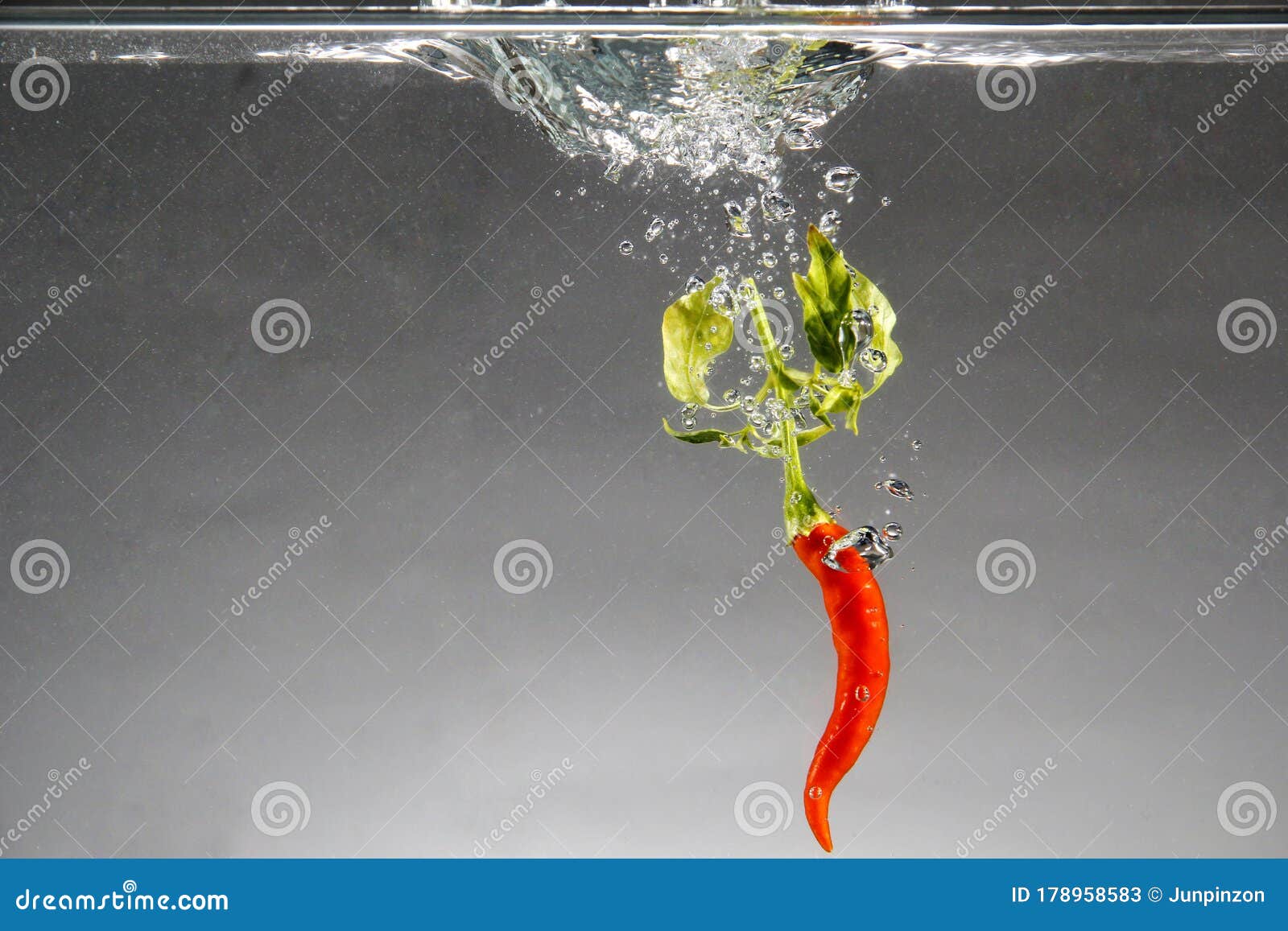Red chili dropped in water stock image. Image of health - 178958583