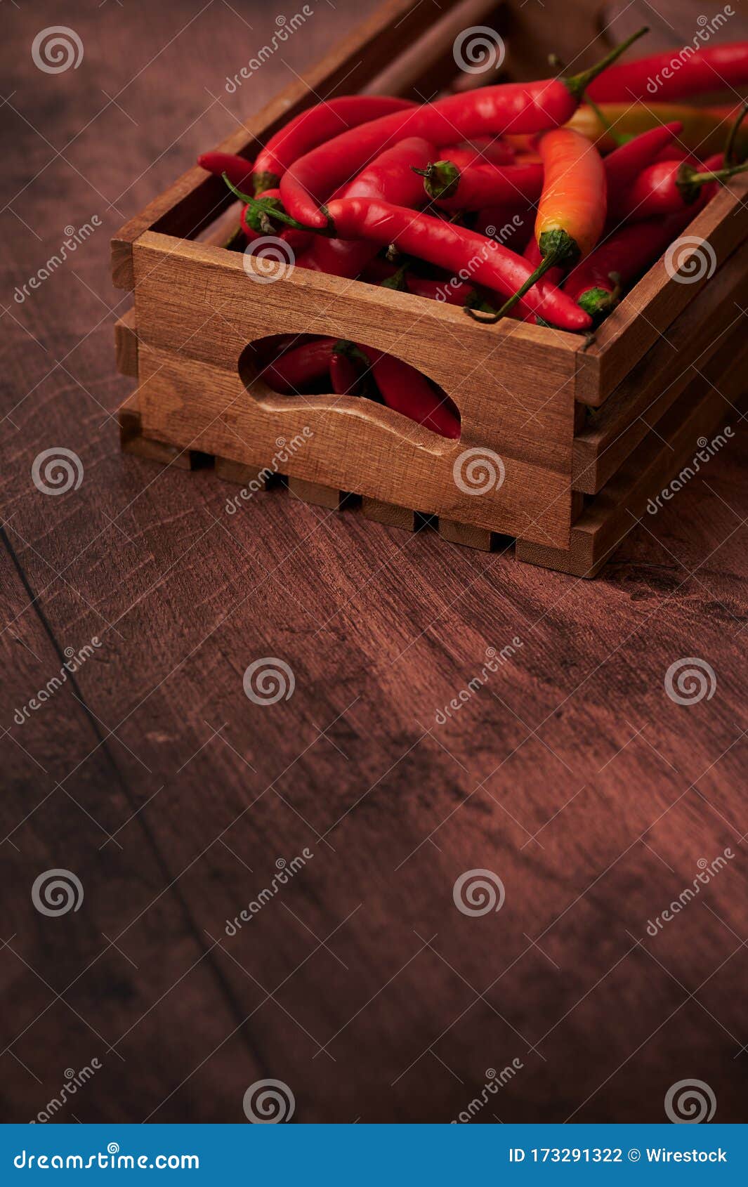 Red Chili Peppers in a Box Put on a Wooden Surface Stock Photo - Image ...