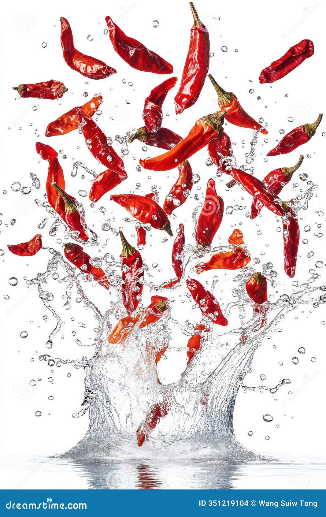 Red Chili Peppers Creating Water Splash on White Background Stock ...