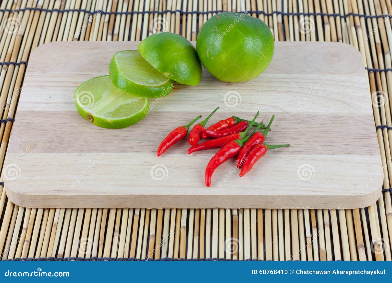 Red Chilli and Lemon on Cutting Board Stock Photo - Image of chilli ...