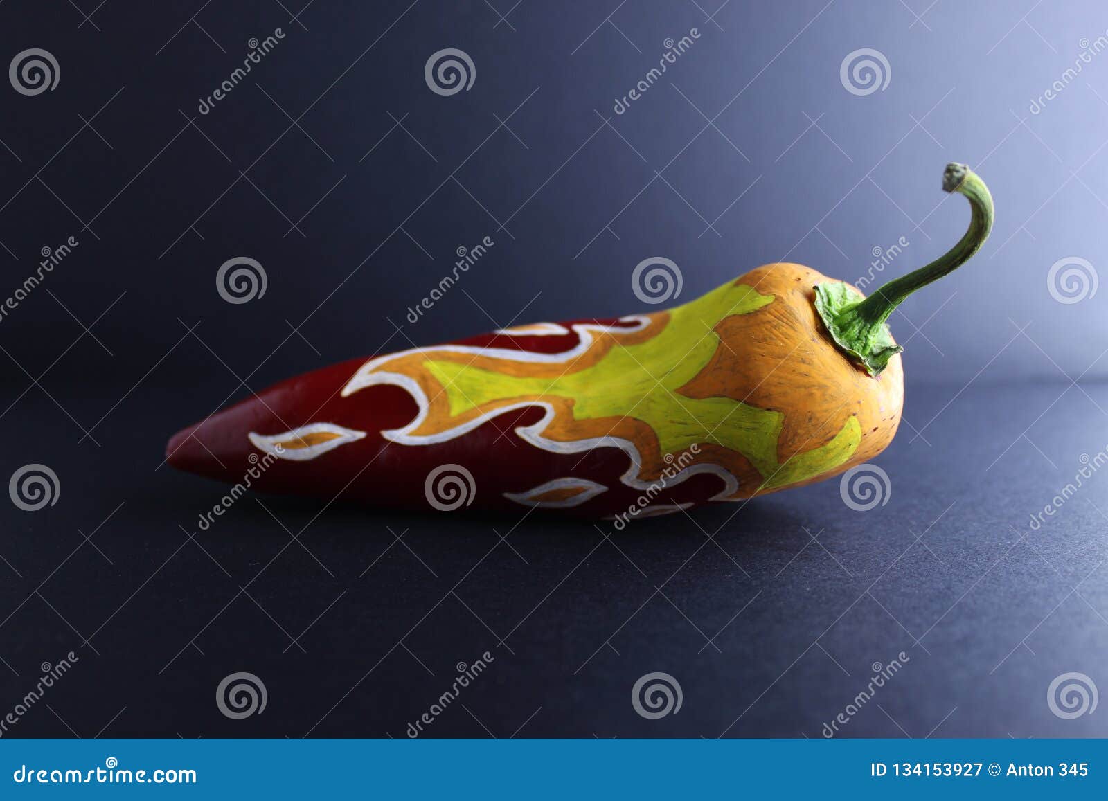 Red Chilli Pepper with Painted Fire on Black Craft Paper Background ...
