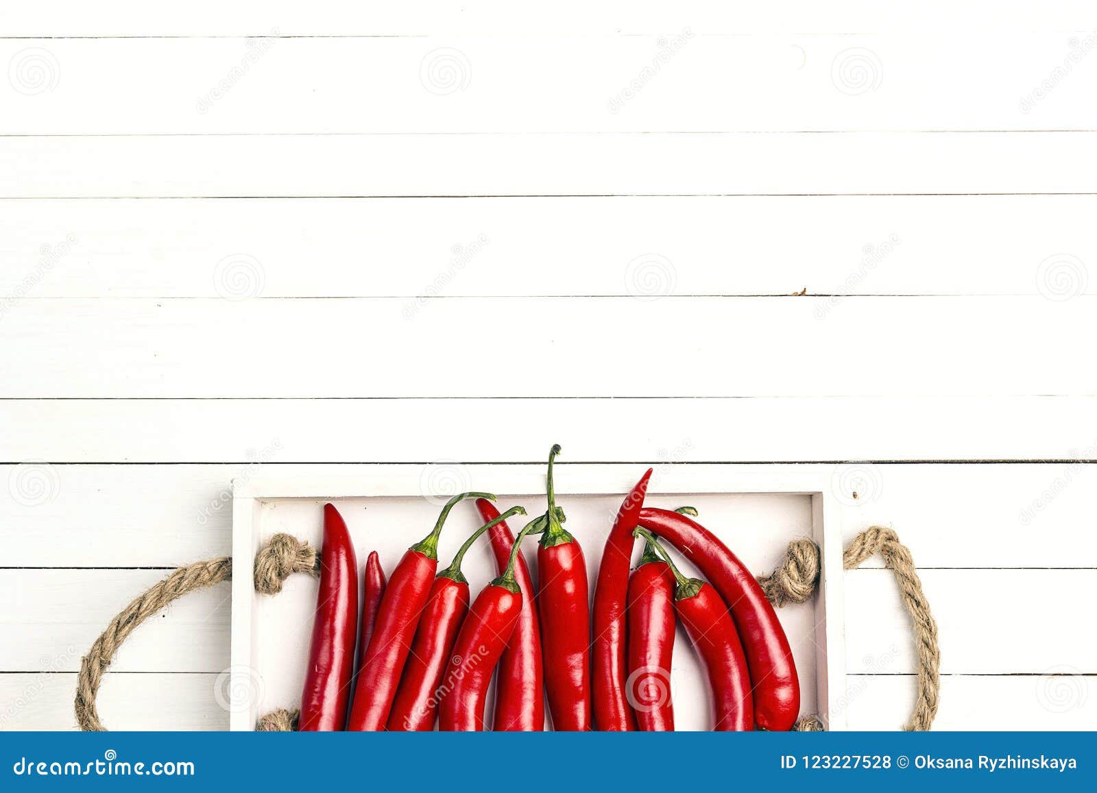Red Chilli Pepper in the Tray on a White Table Witgh Copy Space. Stock ...