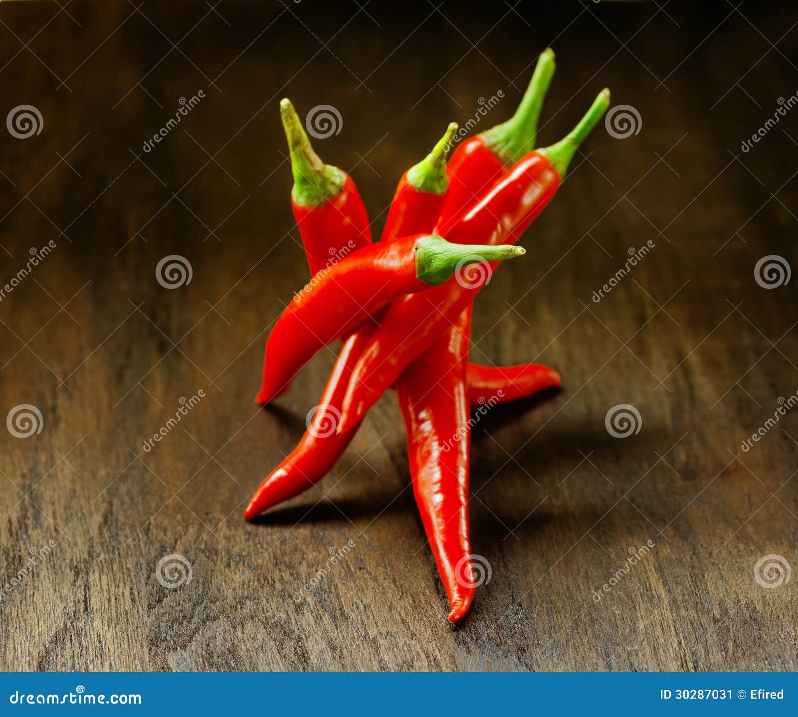 Red Chilli Peppers on Wooden Table Stock Image - Image of brown, pepper ...