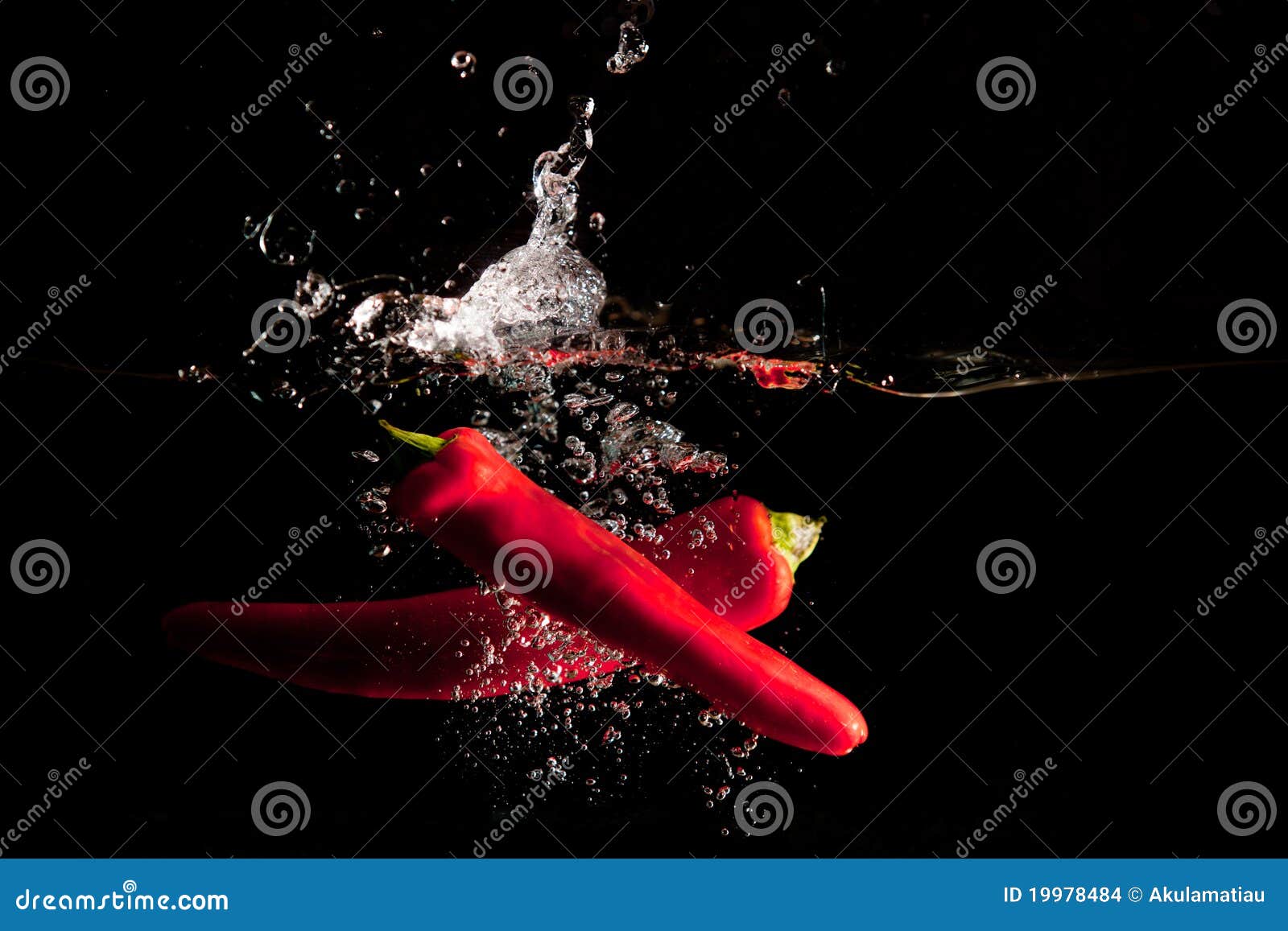 Red Chillies Water Splash stock photo. Image of ripple - 19978484