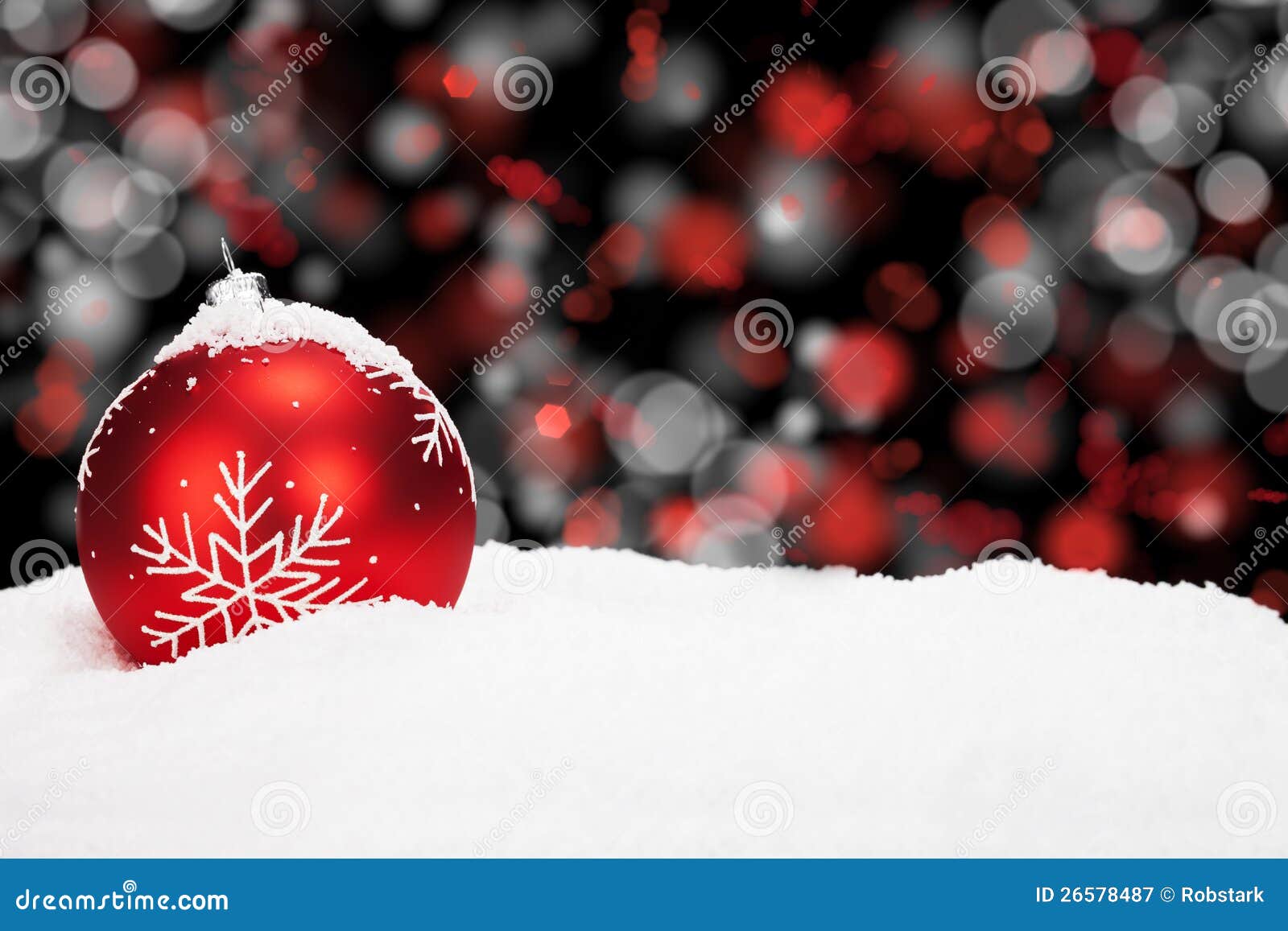 Red christmas ball in snow stock image. Image of celebration - 26578487