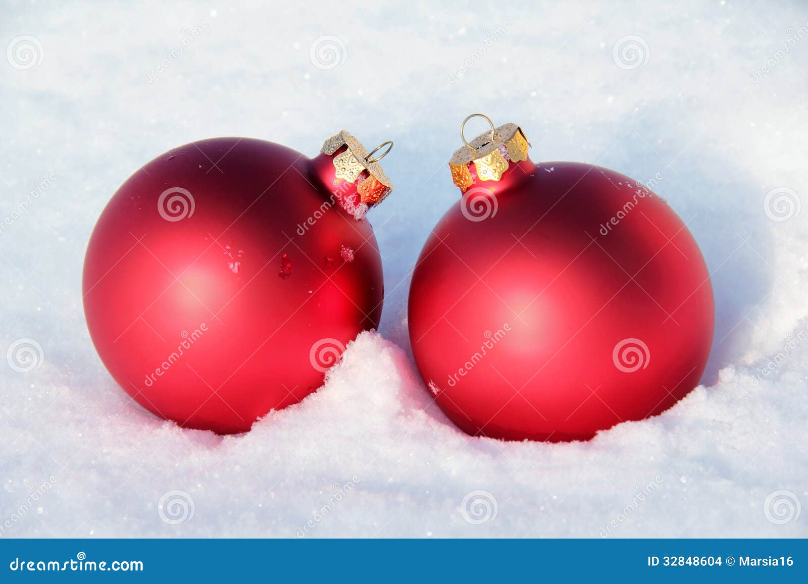 Red Christmas Balls in the Snow Stock Photo - Image of freeze, holiday ...