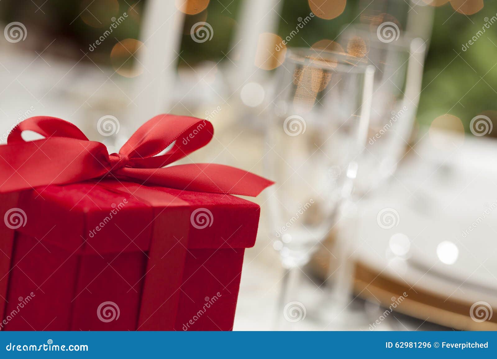 Red Christmas Gift with Place Setting at Table Stock Photo - Image of ...