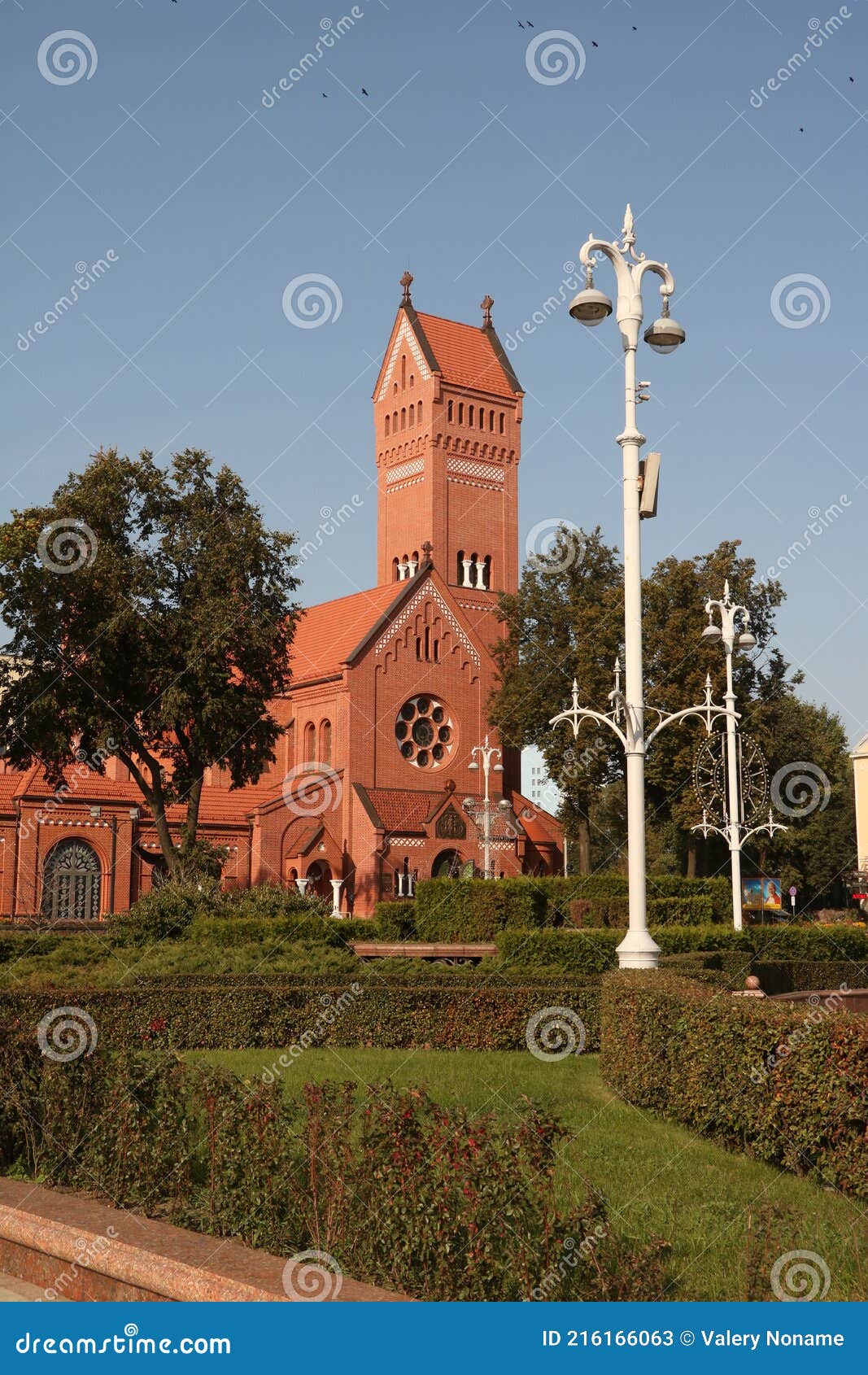 Red church stock image. Image of huddled, greenery, houses - 216166063