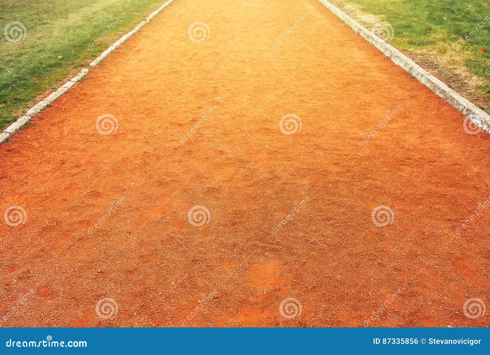 Red clay running track stock photo. Image of practice - 87335856
