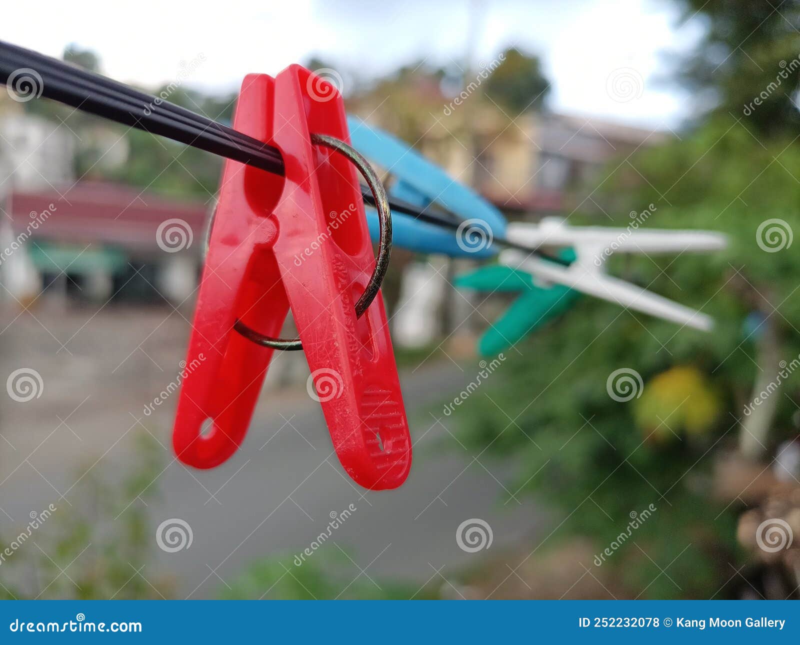 Red Clothespin on the Cable . Clamp Stock Photo - Image of clothespin ...