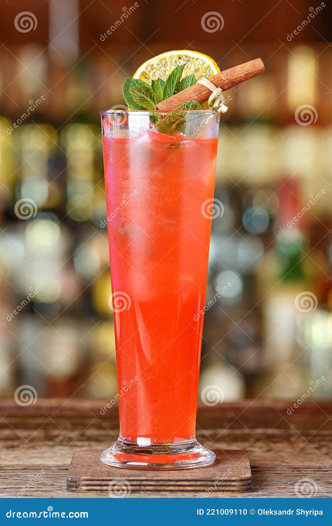 Red cocktail at the bar stock photo. Image of collins - 221009110