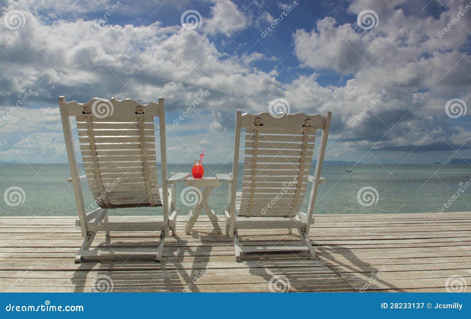 Red Cocktail on White Table Set Over Ocean Stock Image - Image of blue ...
