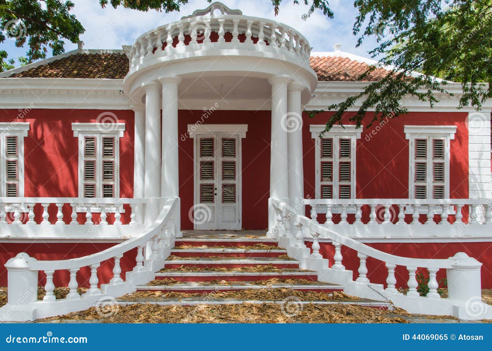 Red Colonial Style House in Willemstad Stock Image - Image of blue ...