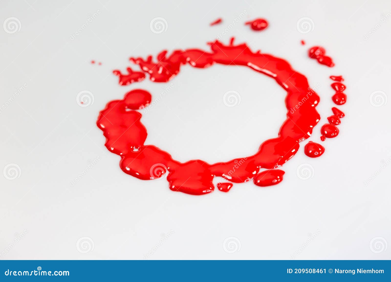 A Red Circle Drips Onto a Spinning White Background. Stock Image ...