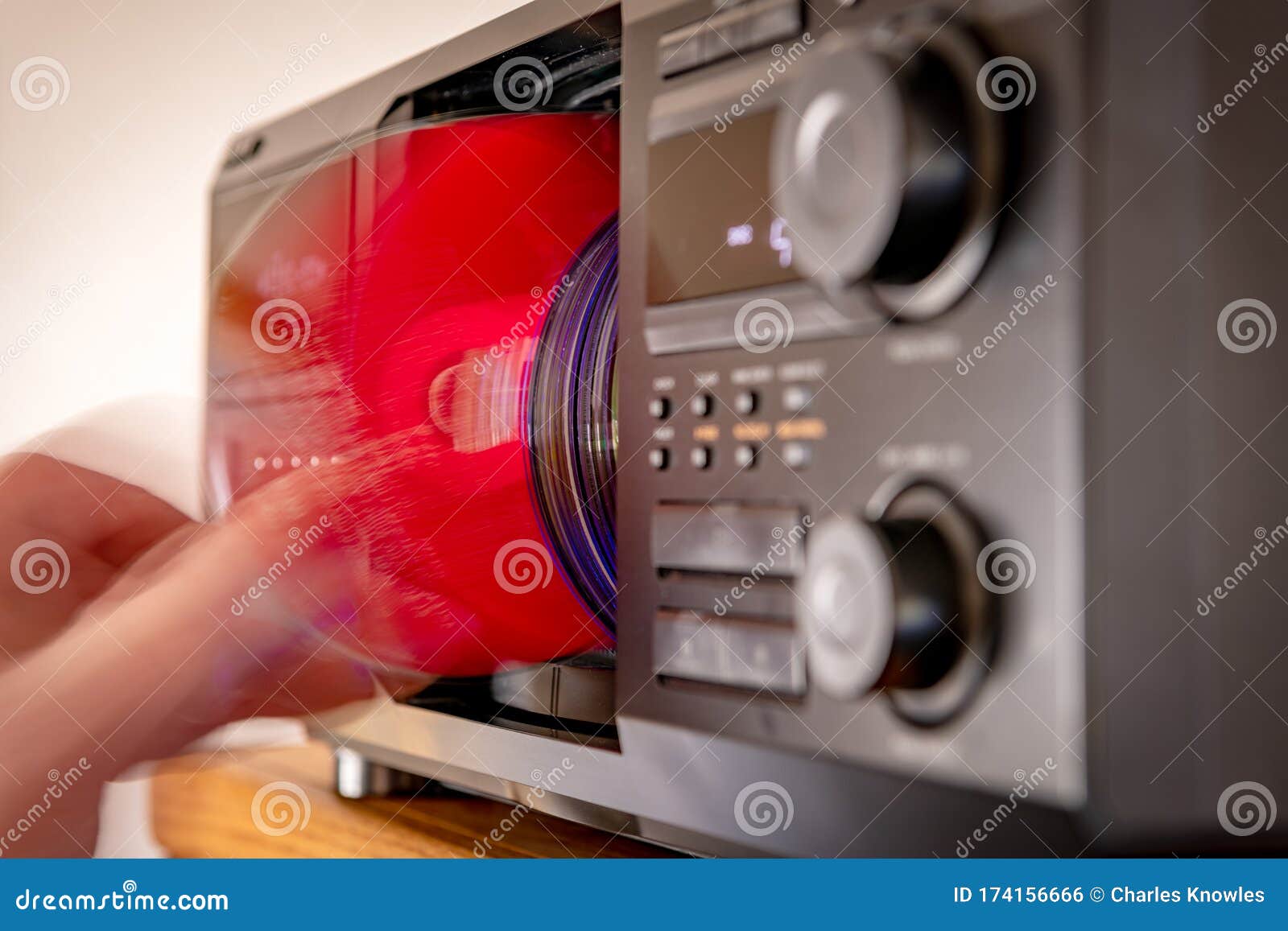 A Red Colored CD is Placed into Its Player Stock Photo - Image of play ...