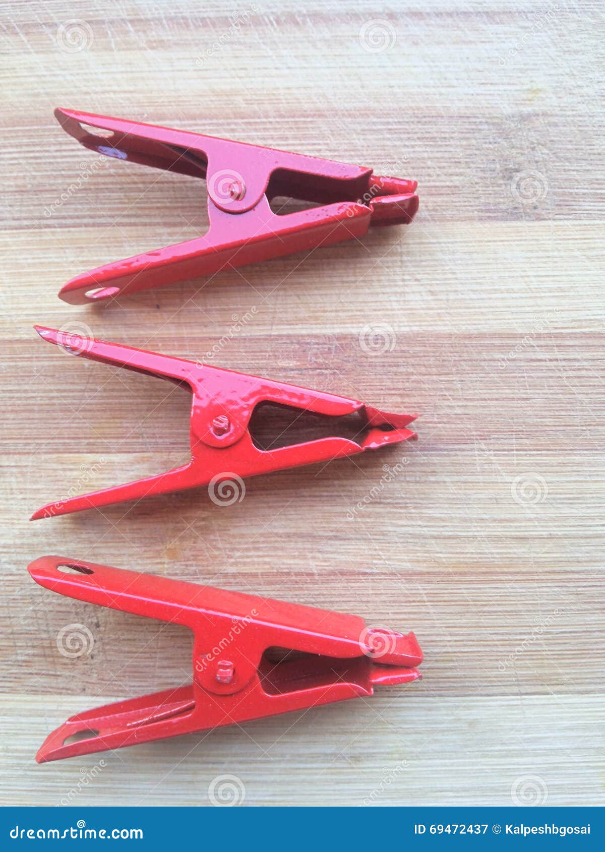 Red Colored Cloth Clips Line on Wooden Background Stock Image - Image ...