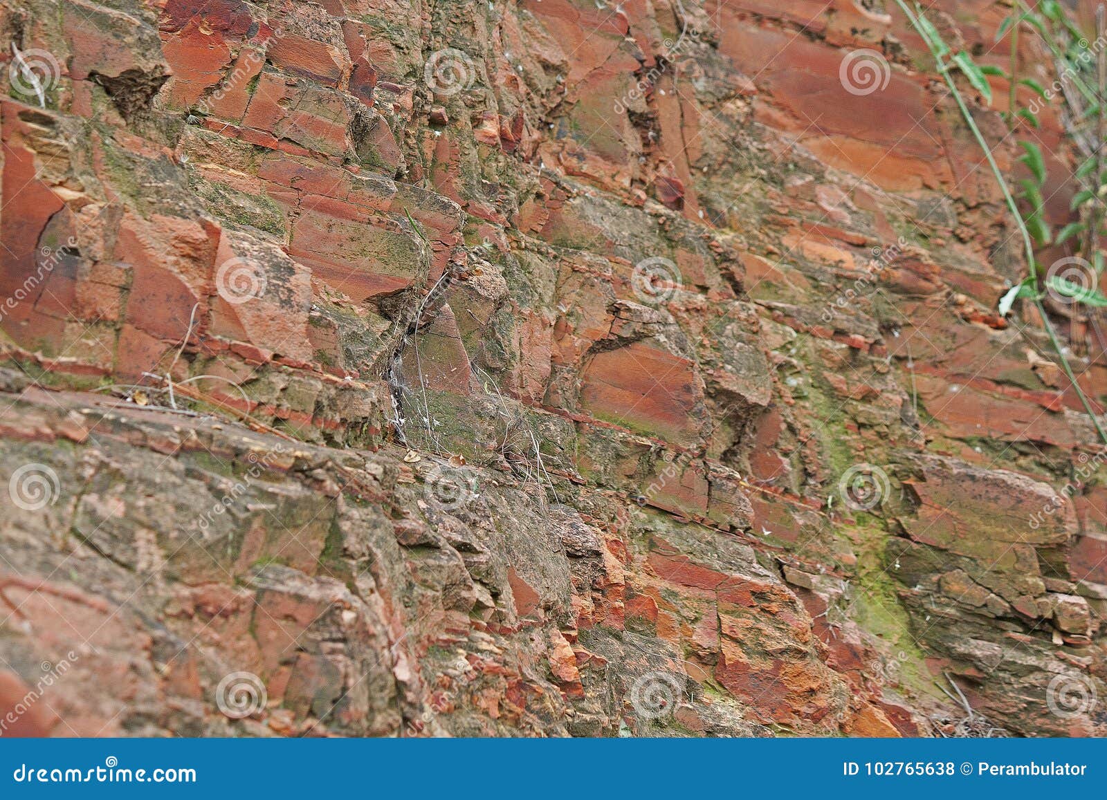 RED COLOURED LAYERS of ROCK with GREEN MOSS Stock Photo - Image of ...