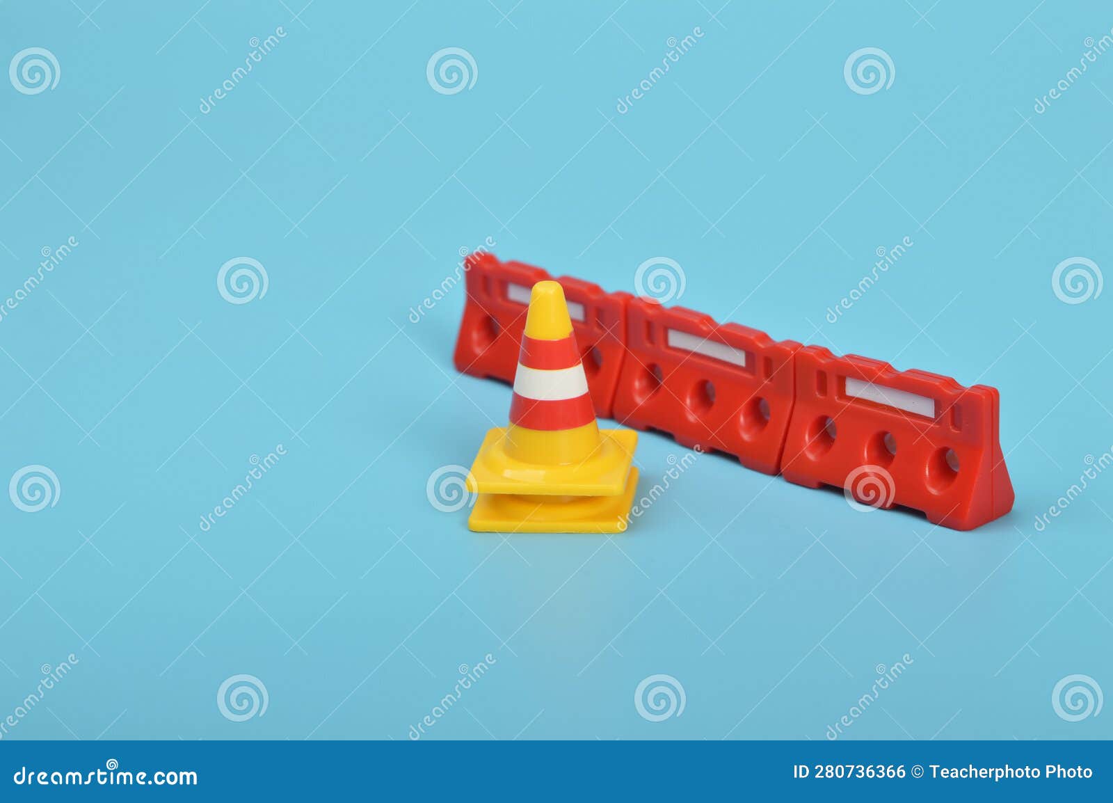 Red Cone and Red Safety Barricades Isolated on a Blue Background Stock ...