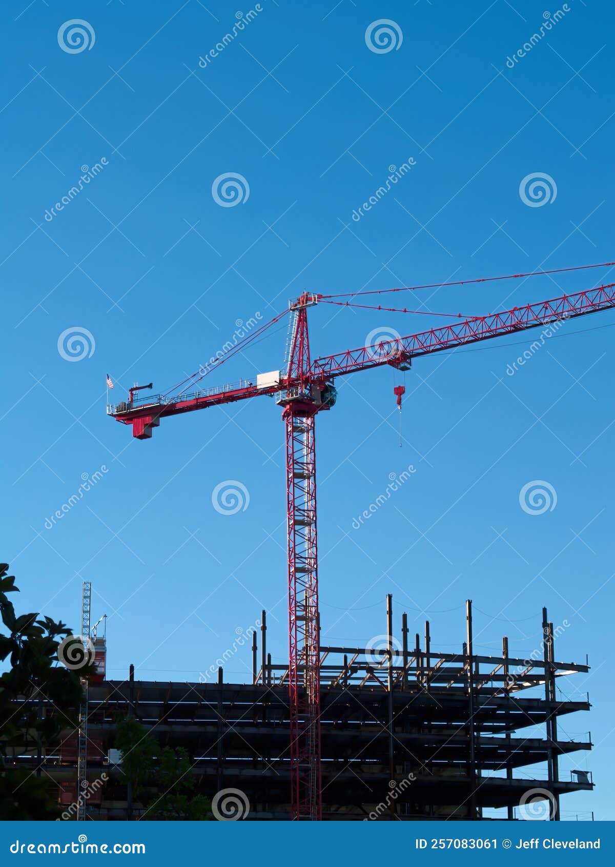 Red Construction Crane and Building Against Blue Sky Stock Image ...