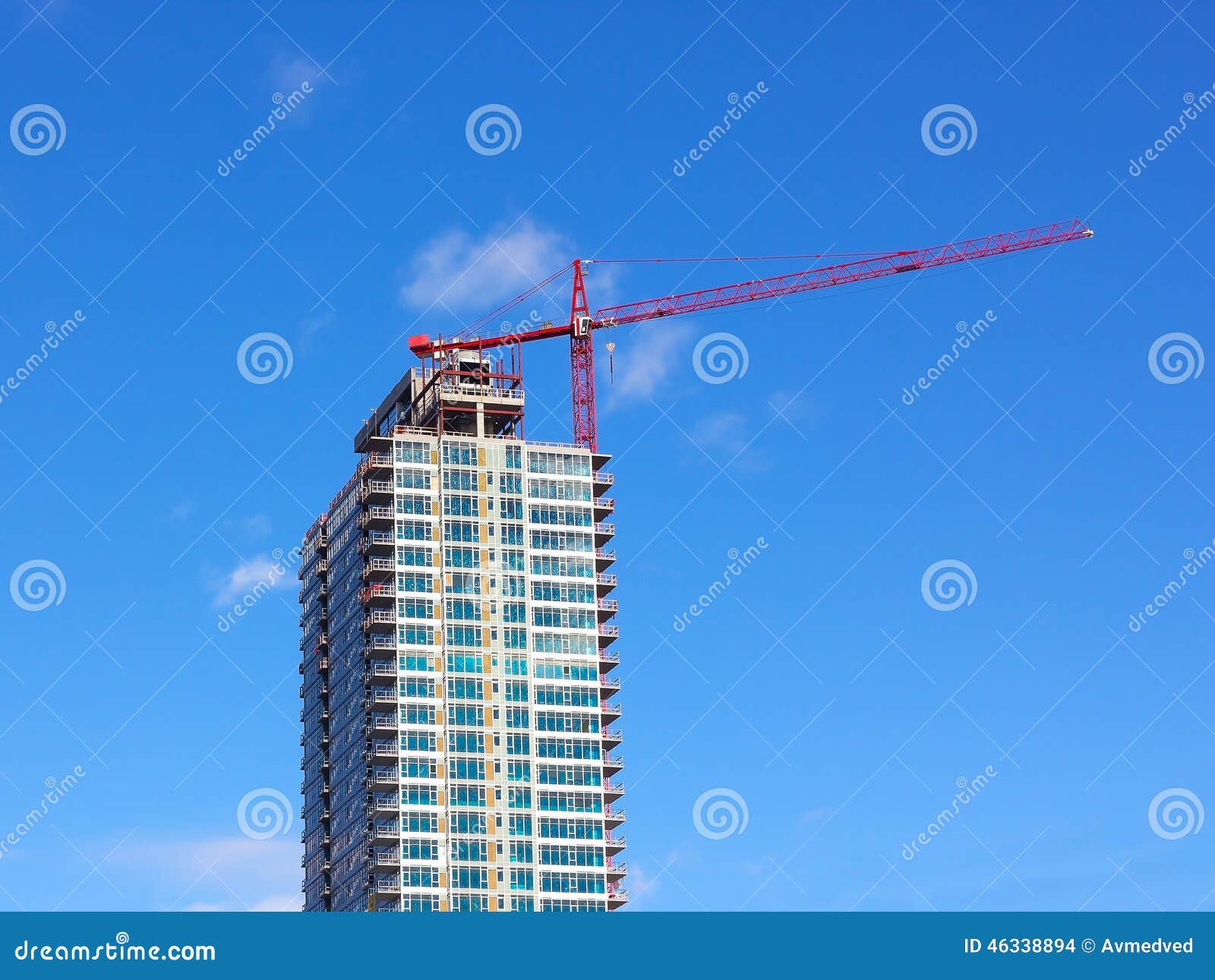 Red Construction Crane and a New Modern Building. Stock Photo - Image ...