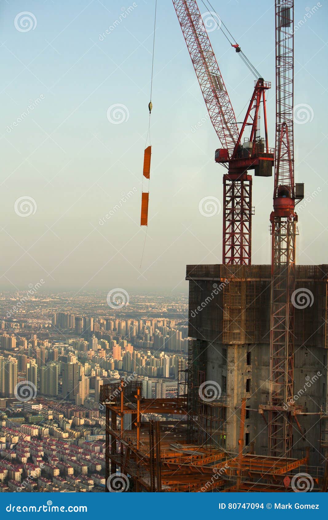 Red Construction Cranes Against Blue Sky Stock Photo - Image of ...