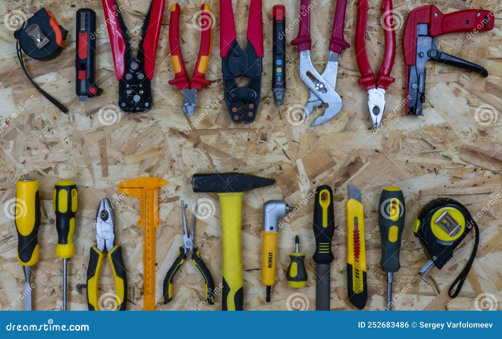 Red Construction Tools Opposite Yellow Working Tools on a Osb ...