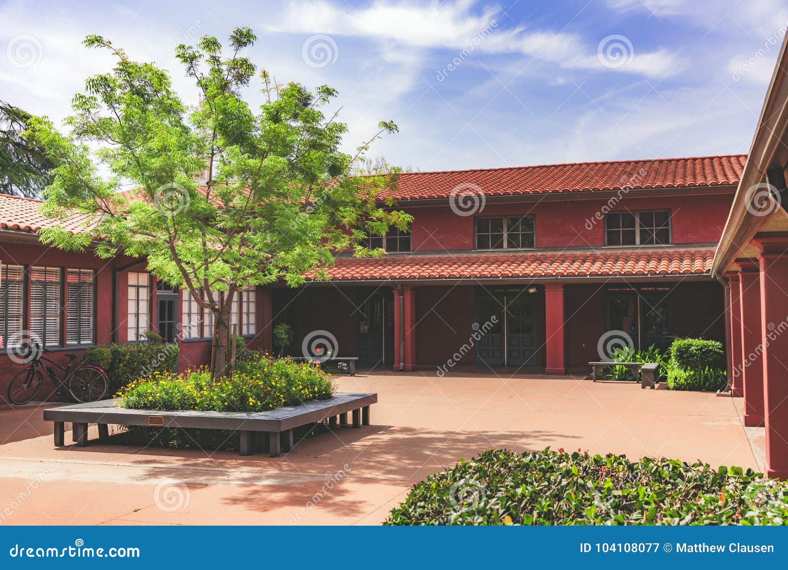 Red Courtyard with a Tree stock image. Image of paved - 104108077