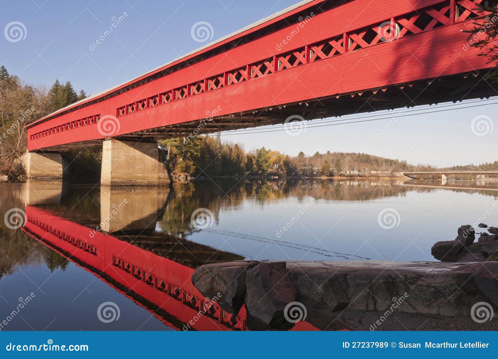 Red Covered Bridge with Reflection in Water Stock Image - Image of ...