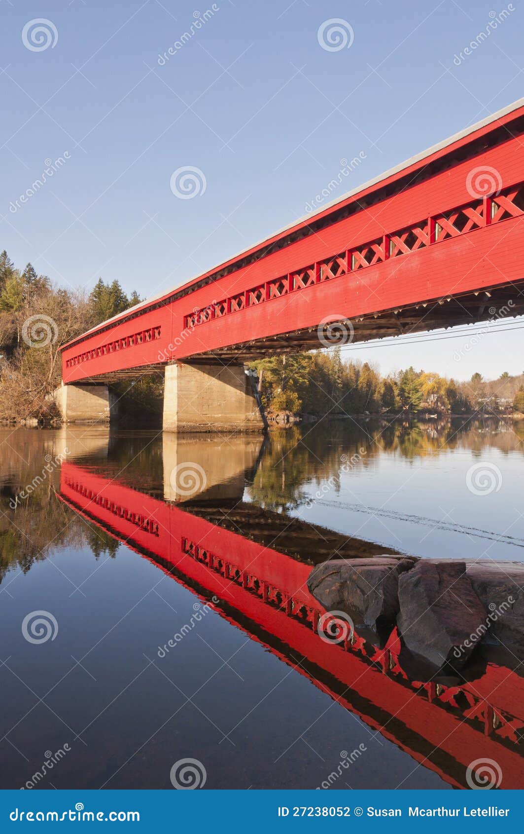 Red Covered Bridge with Reflection in Water Stock Photo - Image of ...
